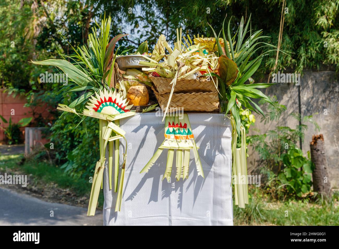 Traditional Balinese offerings for Nyepi celebration on the road along ...