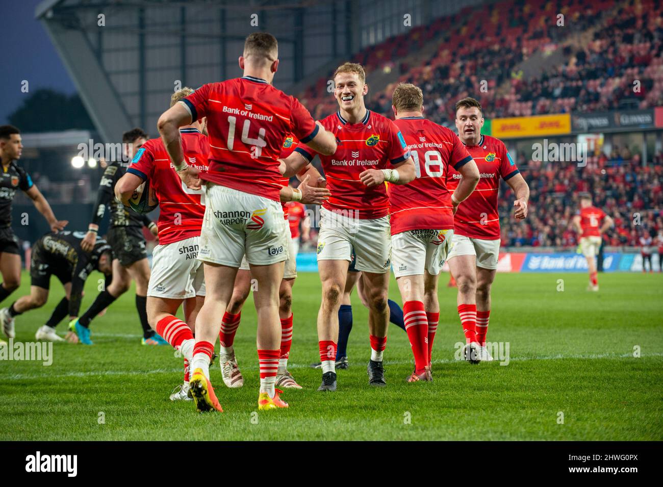 Shane Daly of Munster celebrates scoring with Mike Haley of Munster ...