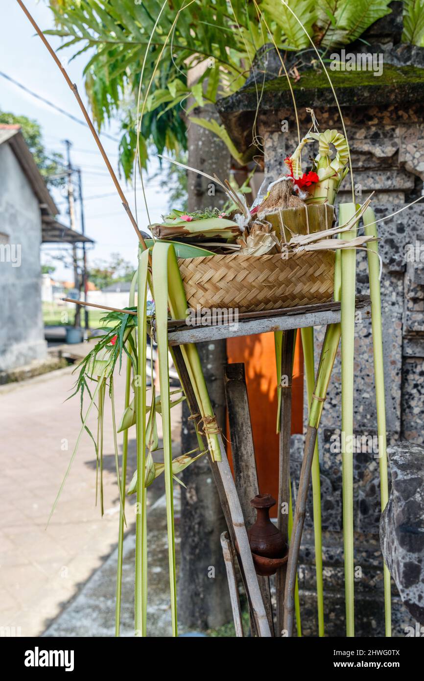 Traditional Balinese offerings for Nyepi celebration on the road along ...
