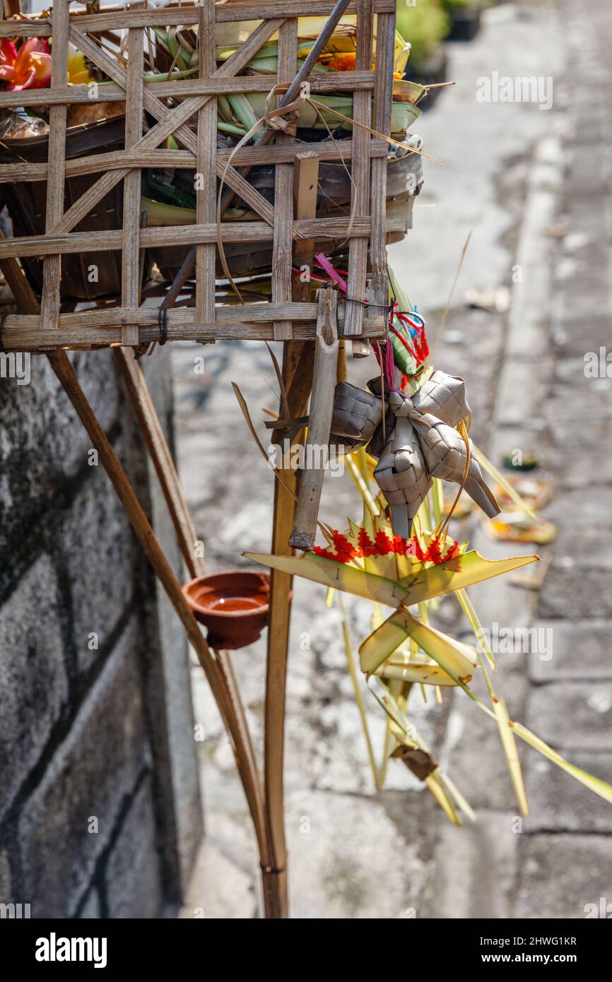 Traditional Balinese offerings for Nyepi celebration on the road along ...