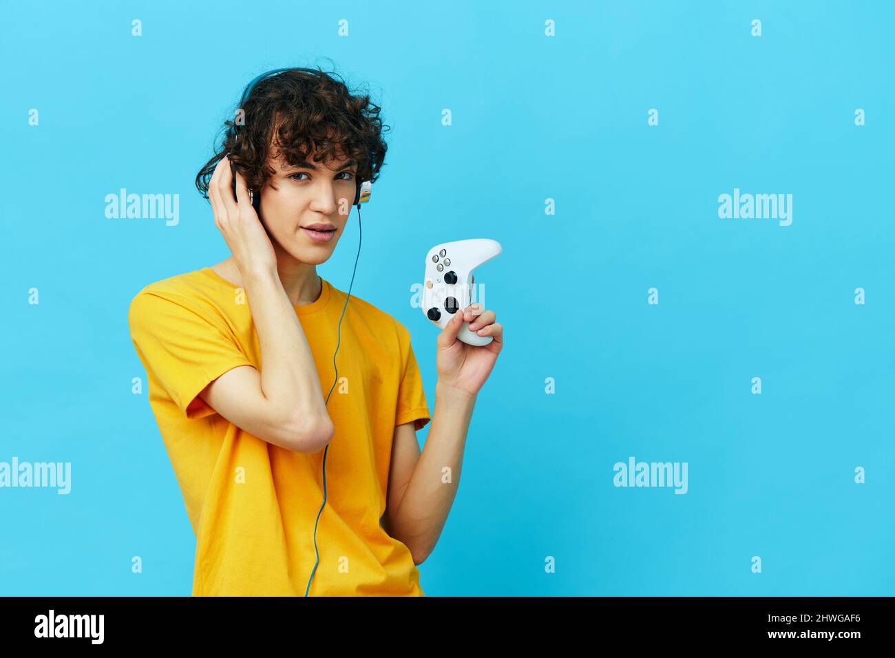 gamer yellow T-shirt with joystick video games isolated backgrounds ...