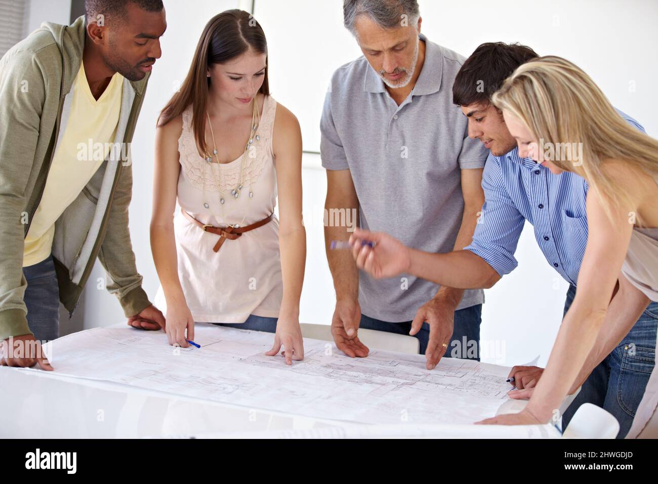 Getting the dimensions right on their blueprints. A team of architects ...