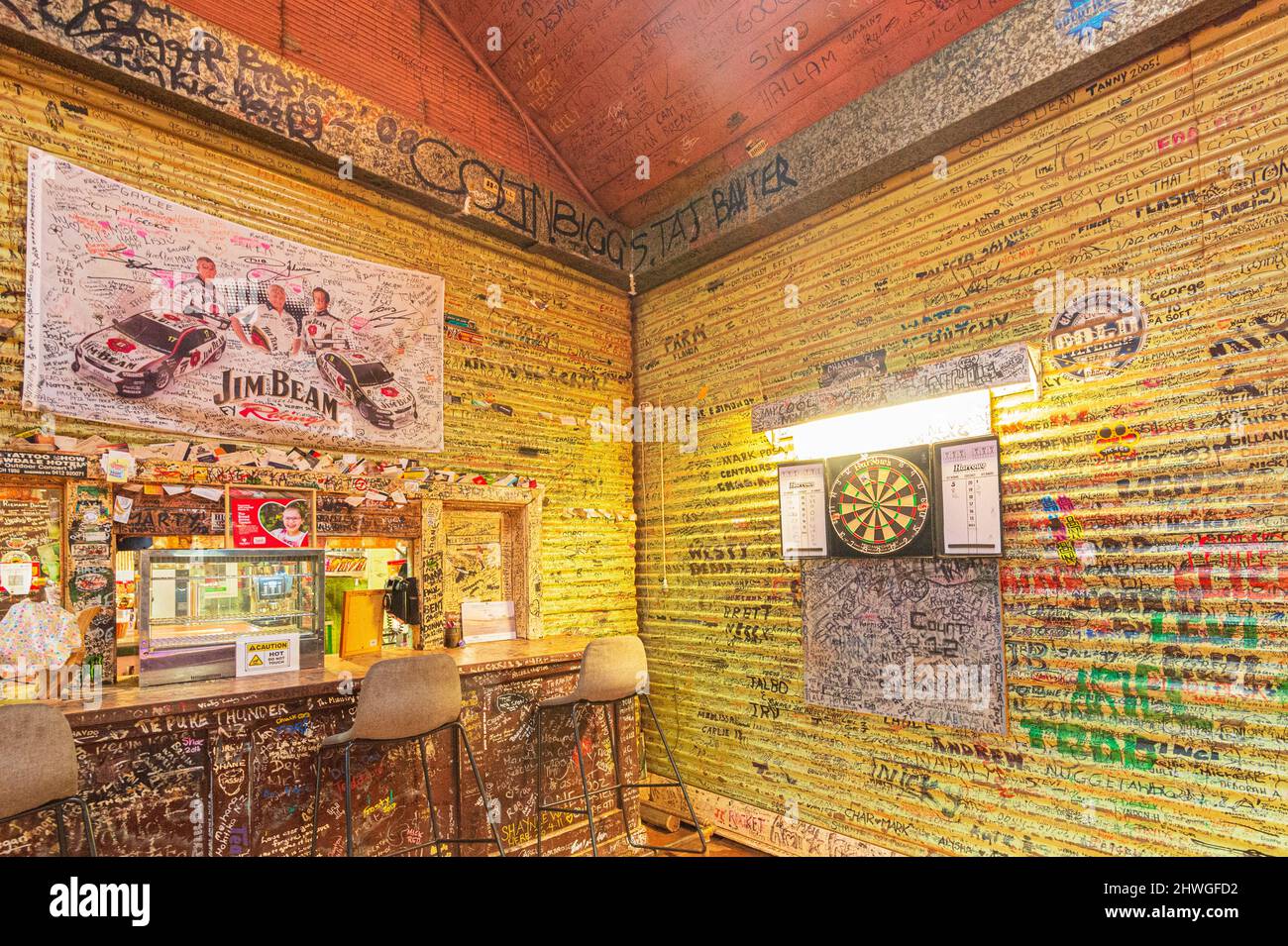 Darts board and graffiti on the walls of a typical Outback pub, the ...