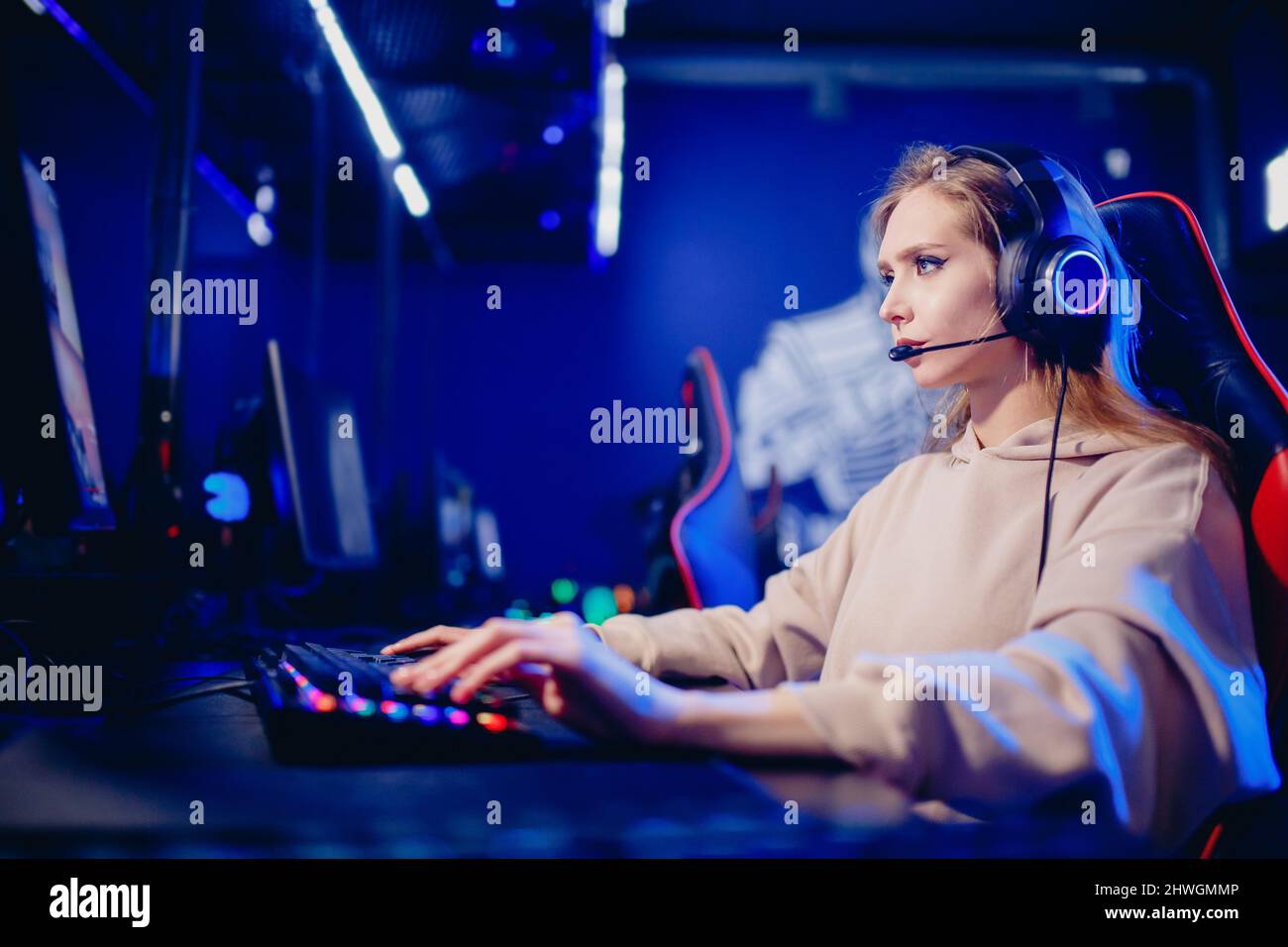 Young woman streamer play on online video game tournament, neon color ...