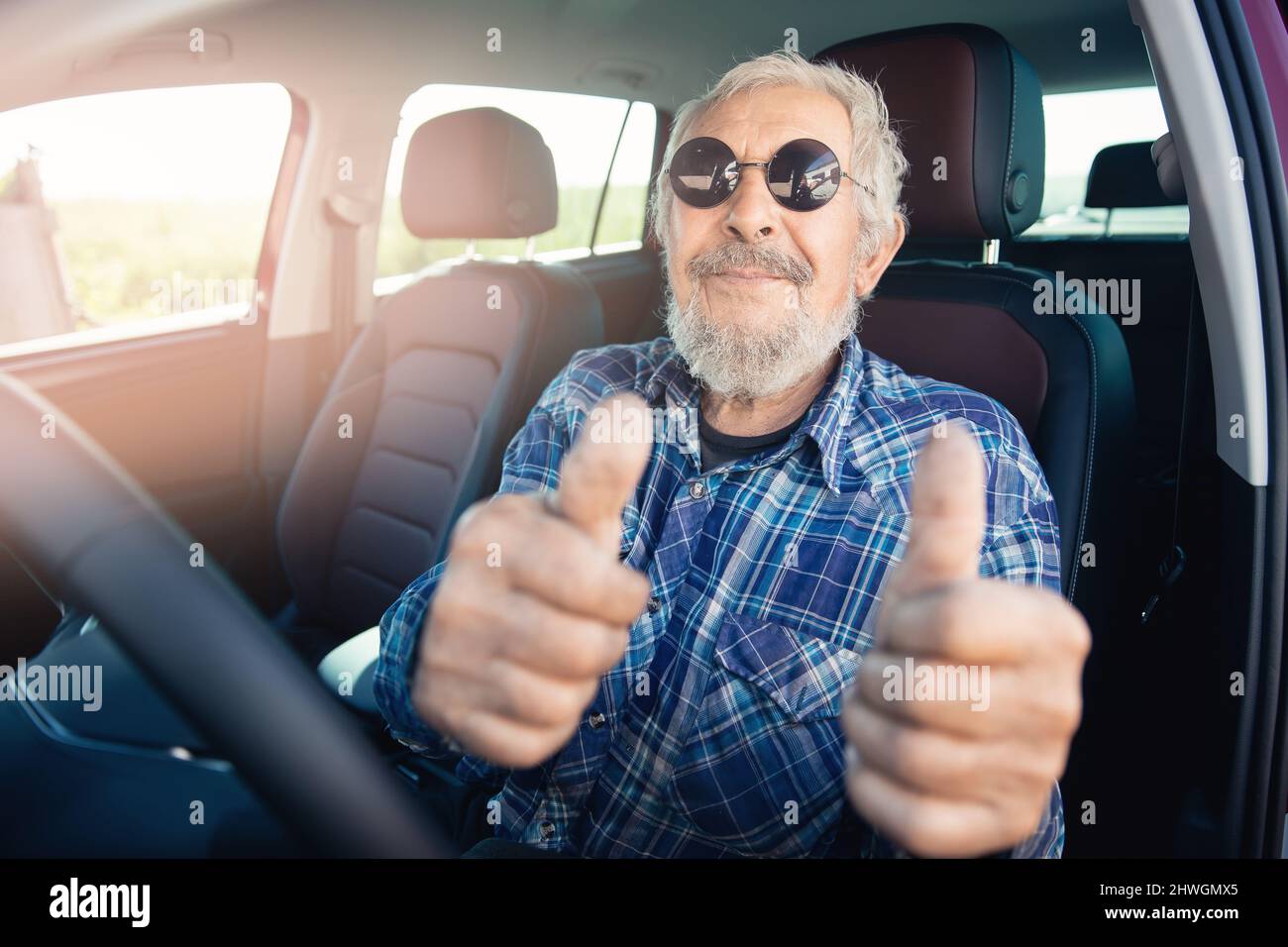 Old man driving luxury car hi-res stock photography and images - Alamy