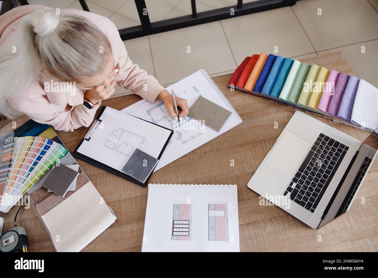 Woman professional architect and interior designer working in workplace ...