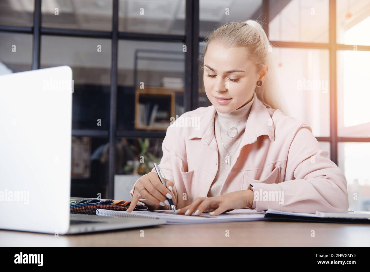 Professional architect and interior designer young woman working in ...