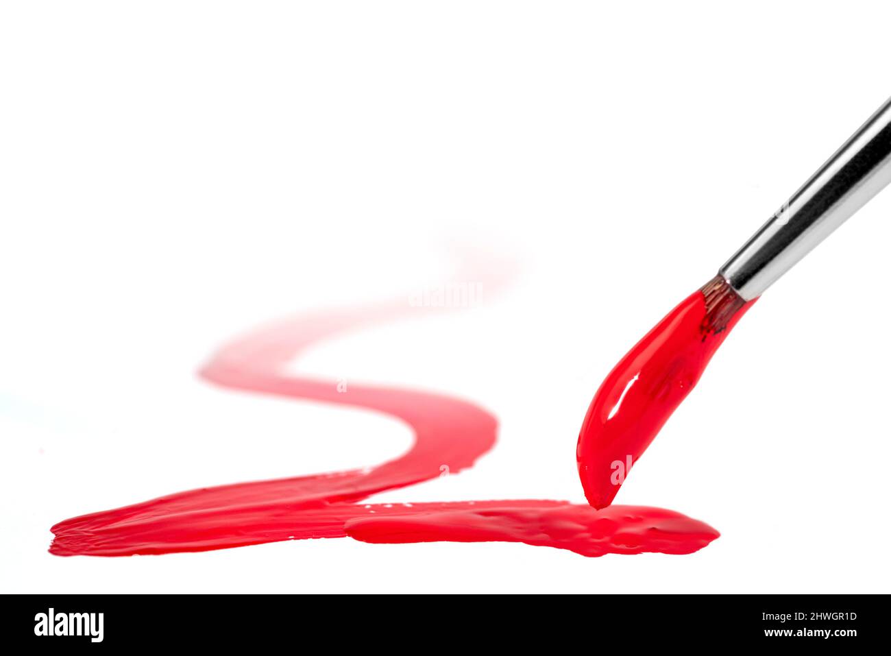 Art and craft theme showing a paintbrush tip and a line of red paint in ...