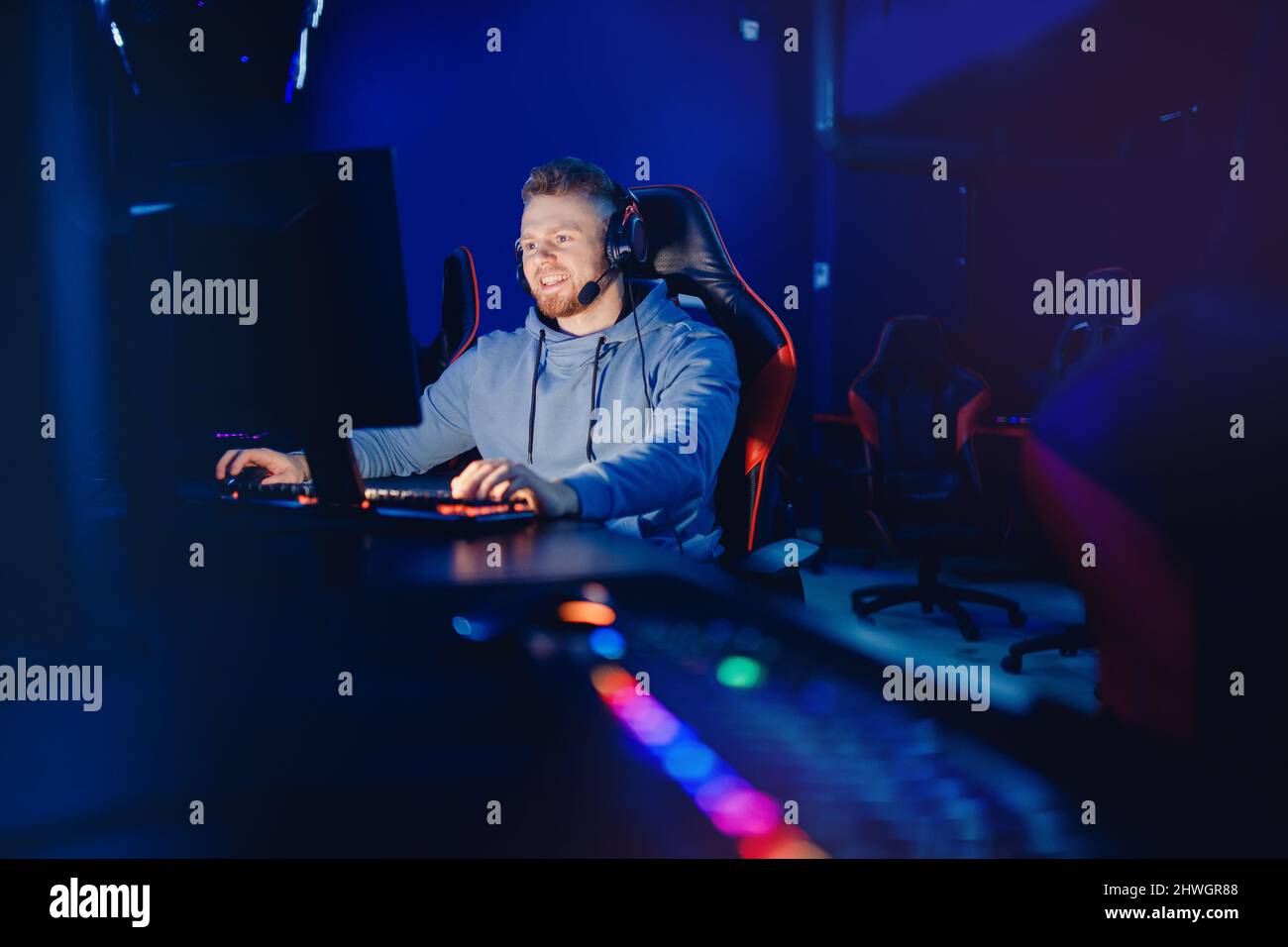 Alone Streamer young man rejoices in victory professional gamer playing ...