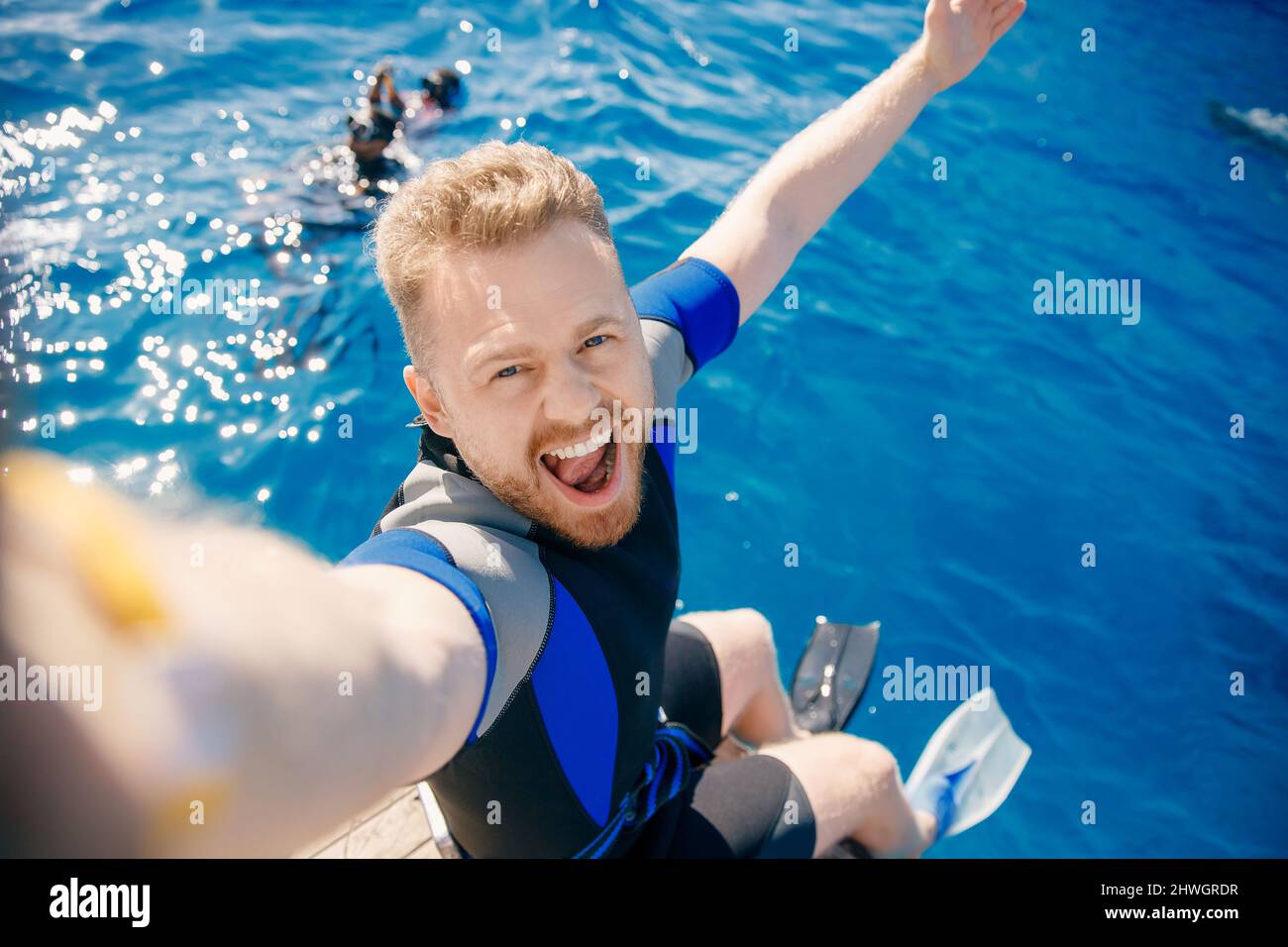 Selfie tourist man in flippers and wetsuit diver to dive into sea on ...