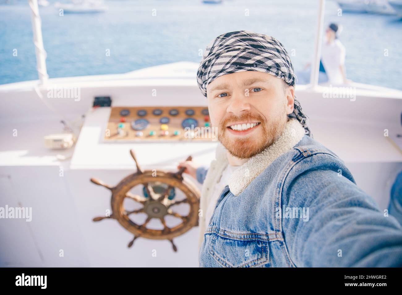 Tourist man on keffiyeh or arabic shawl driver captain of white luxury ...