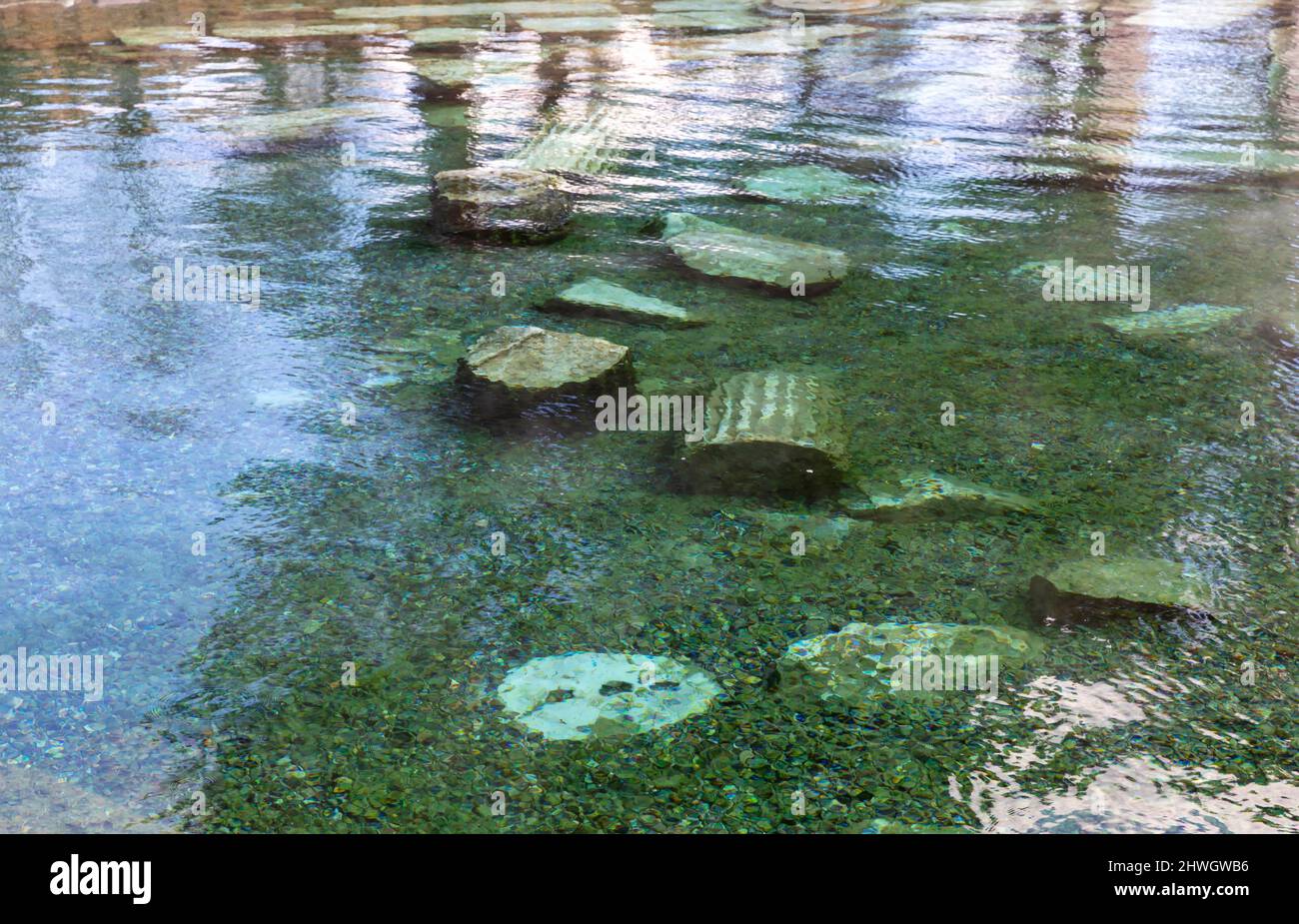 the Antique pool (Cleopatra's Bath) view in Pamukkale. It's a popular ...