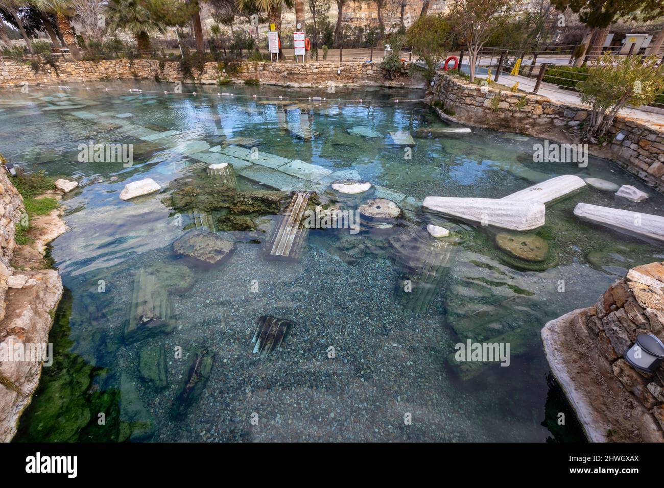 the Antique pool (Cleopatra's Bath) view in Pamukkale. It's a popular ...