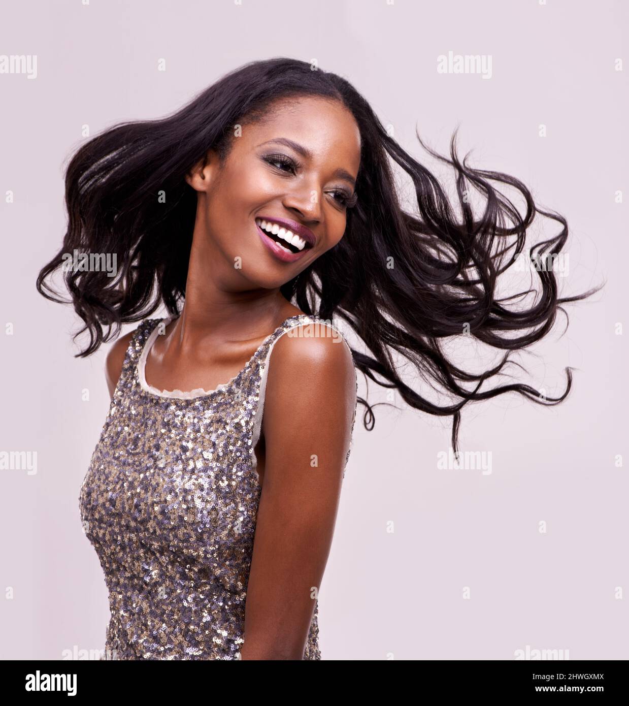 Add a bit of sparkle to your day. Studio shot of an elegant woman ...