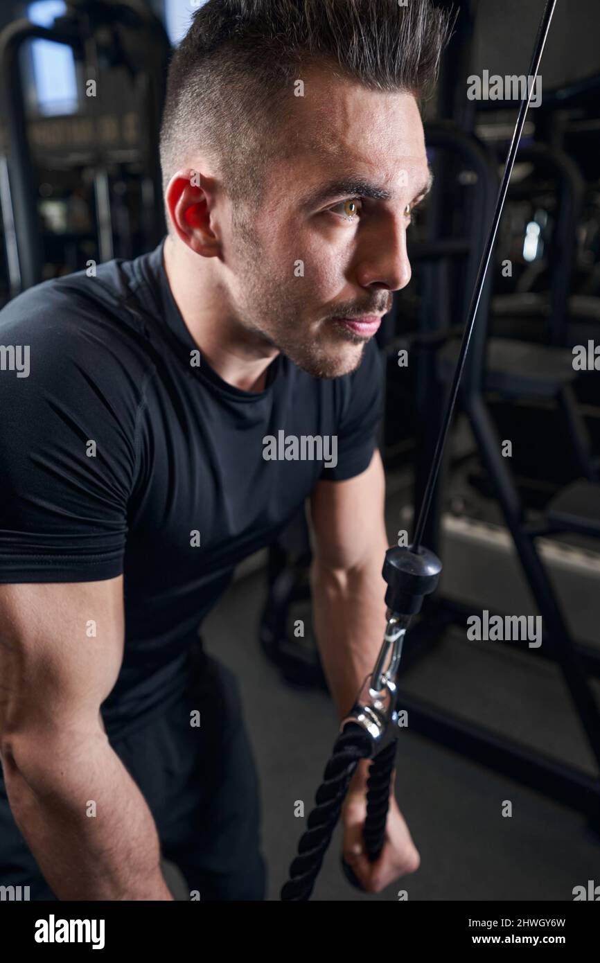 Portrait of serious man pulling the rope Stock Photo - Alamy