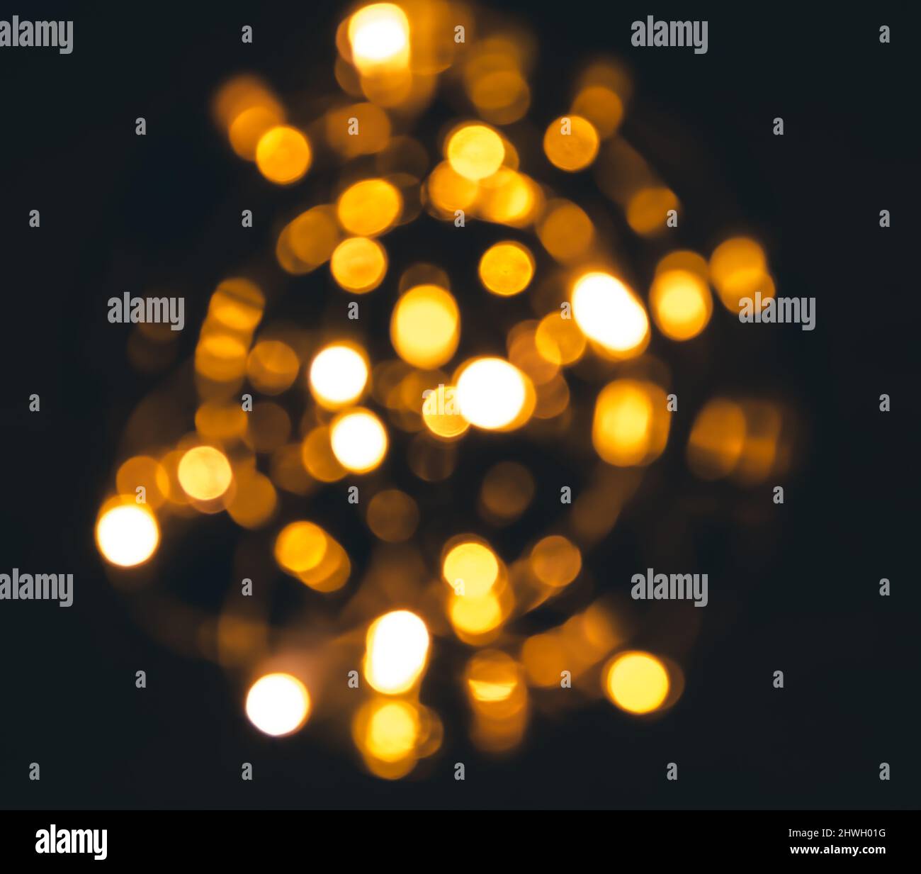 Abstract defocused lights on dark background Stock Photo - Alamy