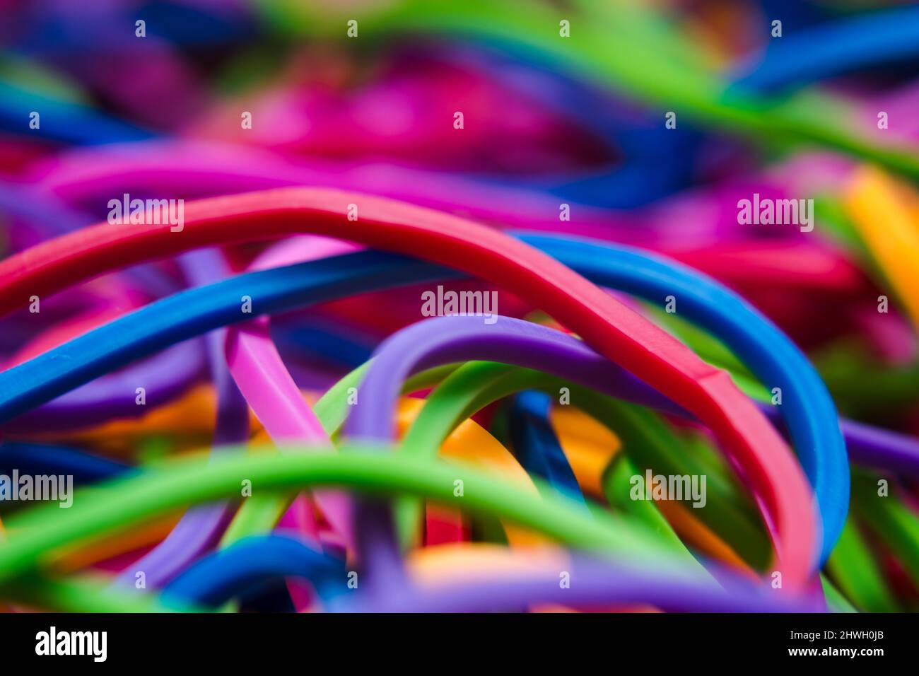 Colorful background rainbow colors rubber bands Stock Photo - Alamy