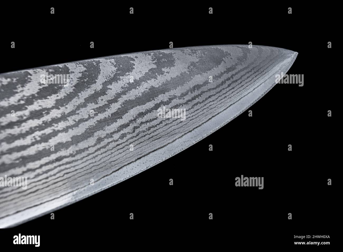 Knife blade of Damascus steel isolated on black Stock Photo - Alamy