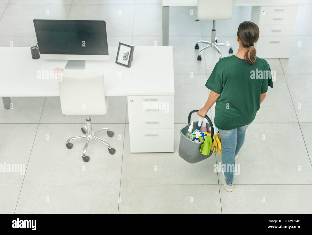 Shell clean it all with one call. High angle shot of a woman cleaning a ...