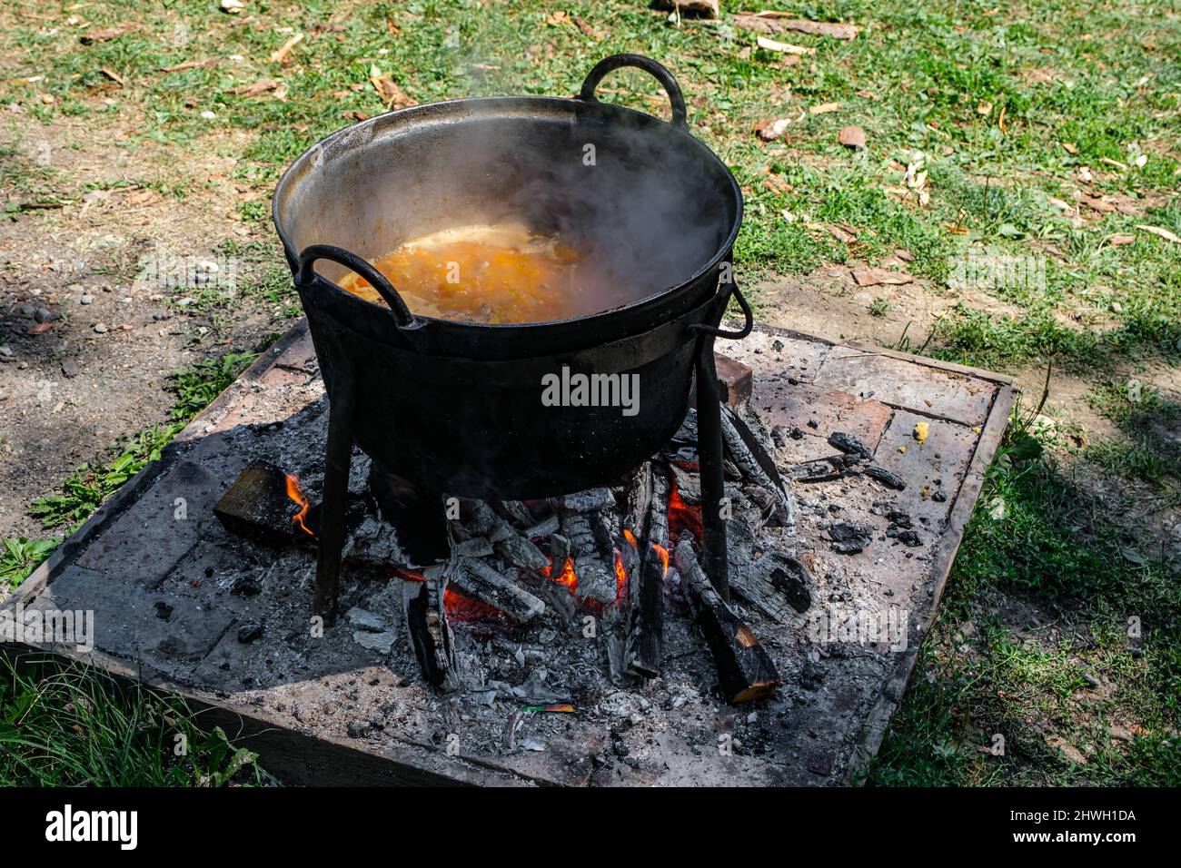 Romanian traditional food prepared at the cauldron on the open fire ...