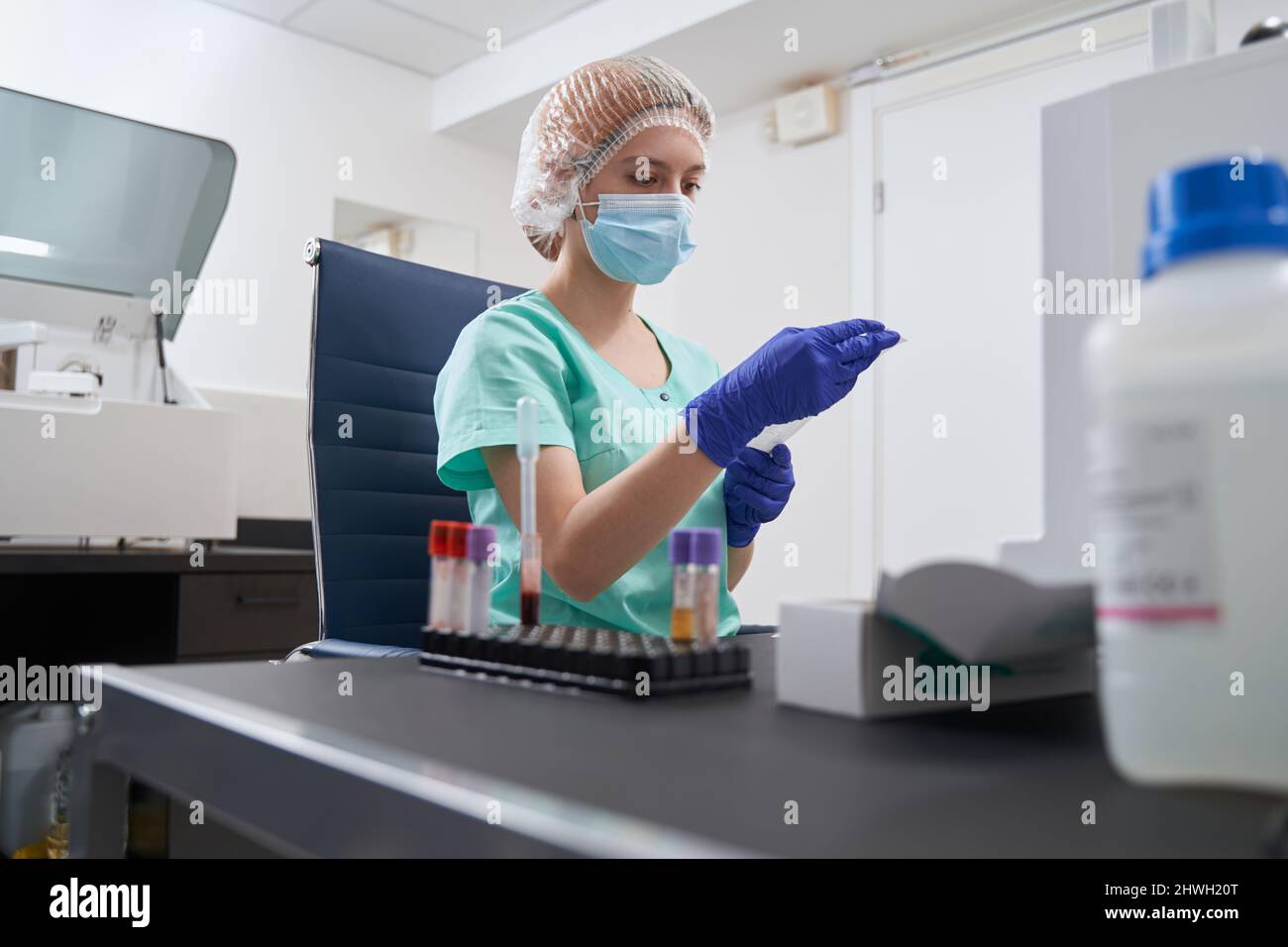 Laboratory assistant checking information in the hospital Stock Photo ...