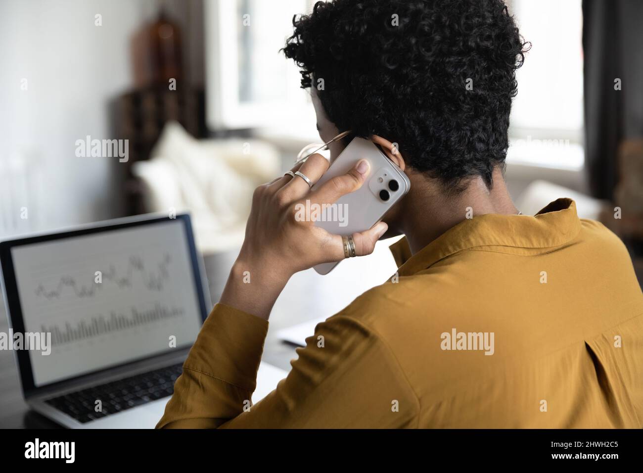 African American business professional woman using talking to client ...