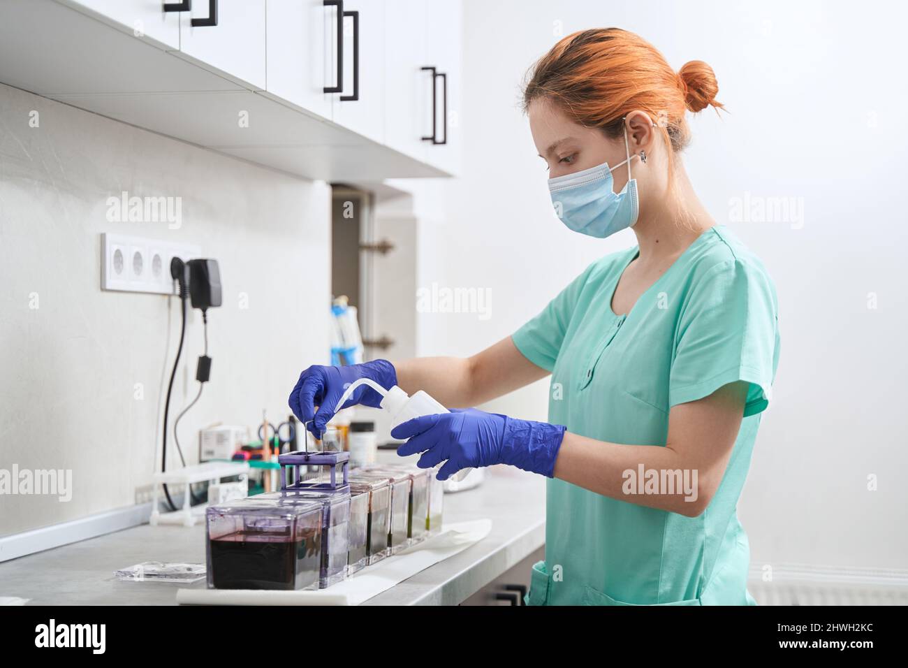 Doctor working with instruments in the laboratory Stock Photo - Alamy