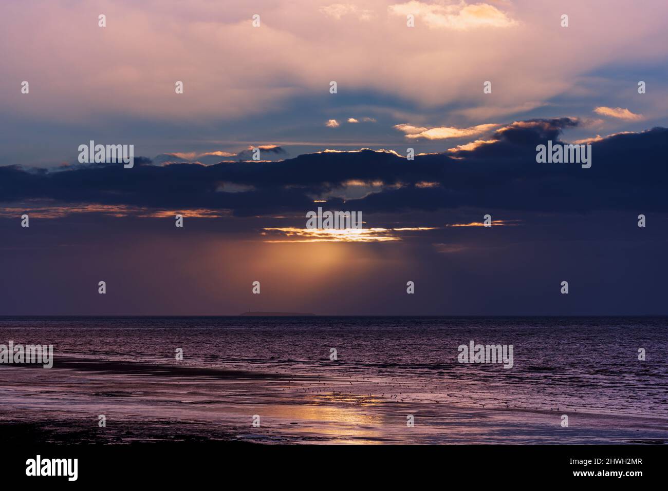 Sunlight reflecting onto the mud Stock Photo - Alamy