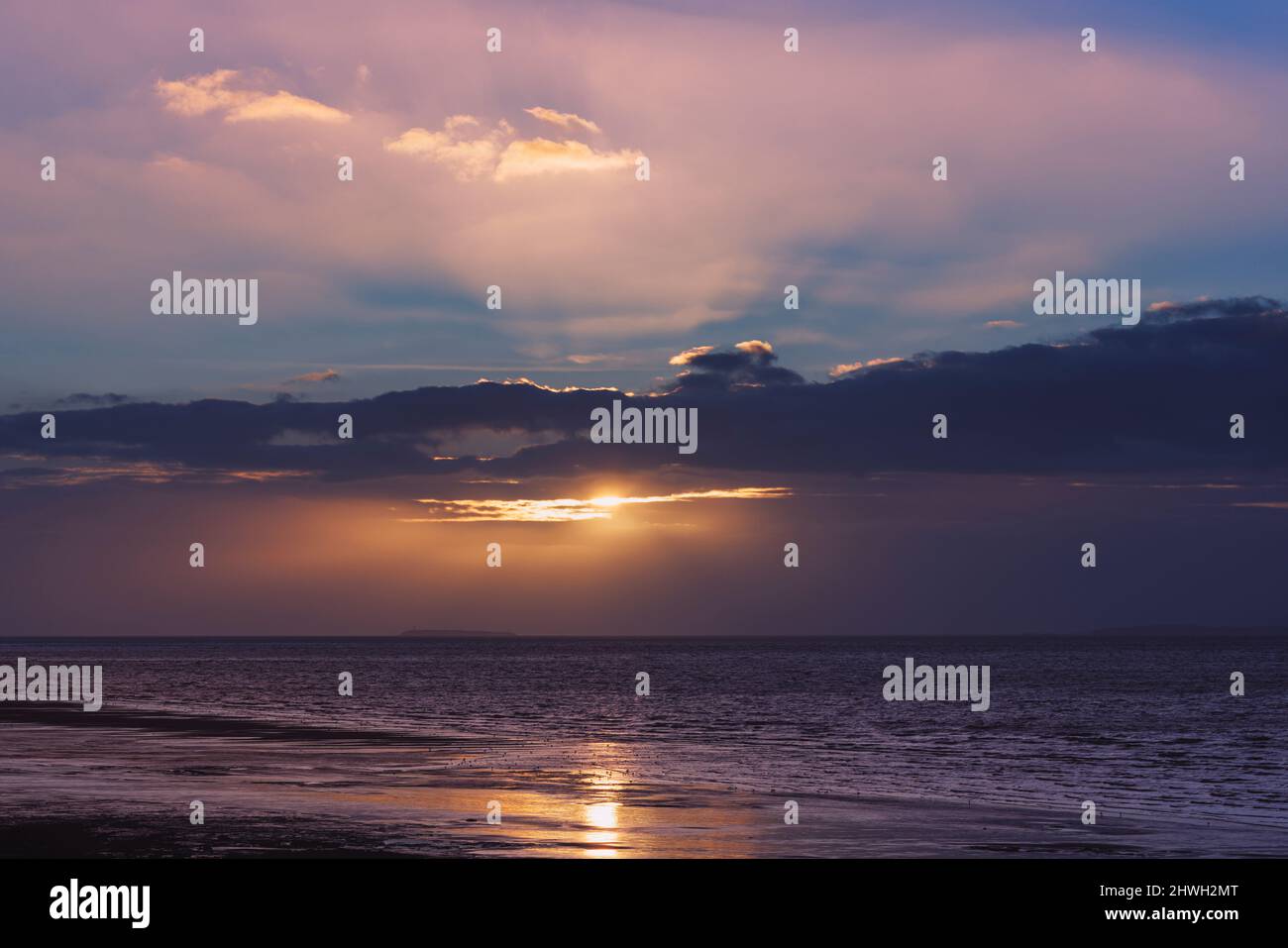 Sunlight reflecting onto the mud Stock Photo - Alamy