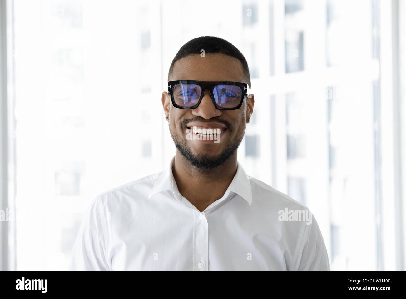 Portrait of happy handsome millennial African American employee Stock ... Portrait of happy handsome millennial African American employee Stock ...