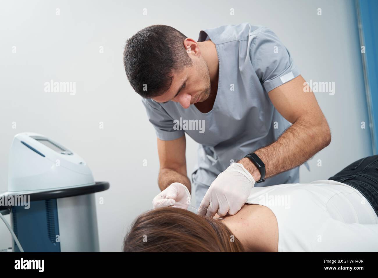 Portrait of acupuncturist at the acupuncture session Stock Photo - Alamy