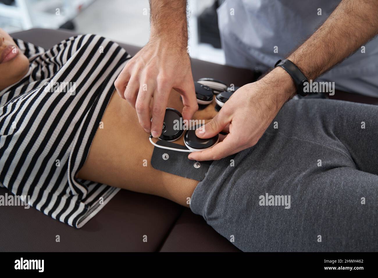 Young female having therapy and rehabilitation with doctor Stock Photo ...