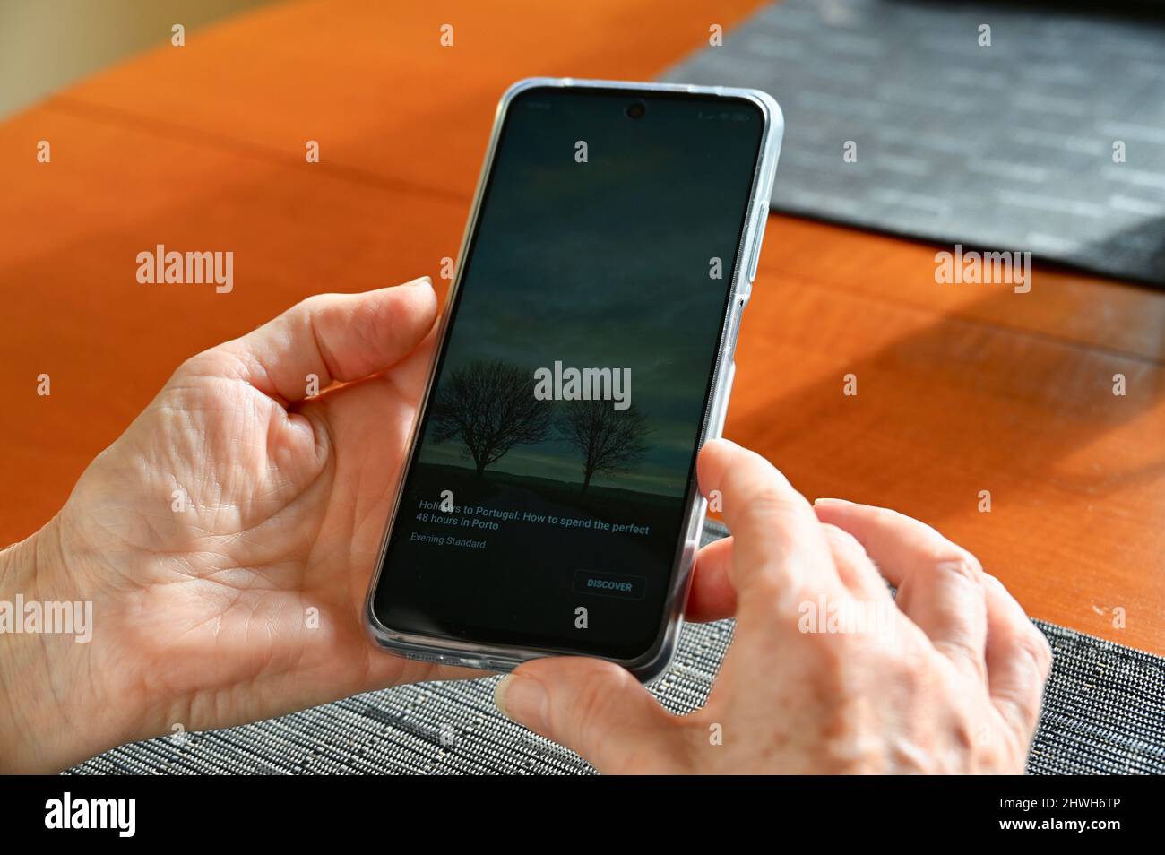 Screenshot. Close-up of senior women holding a mobile phone Stock Photo ...