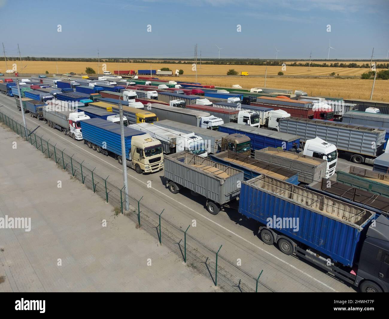 Lots of trucks with trailers in the parking lot. Queue for unloading at ...