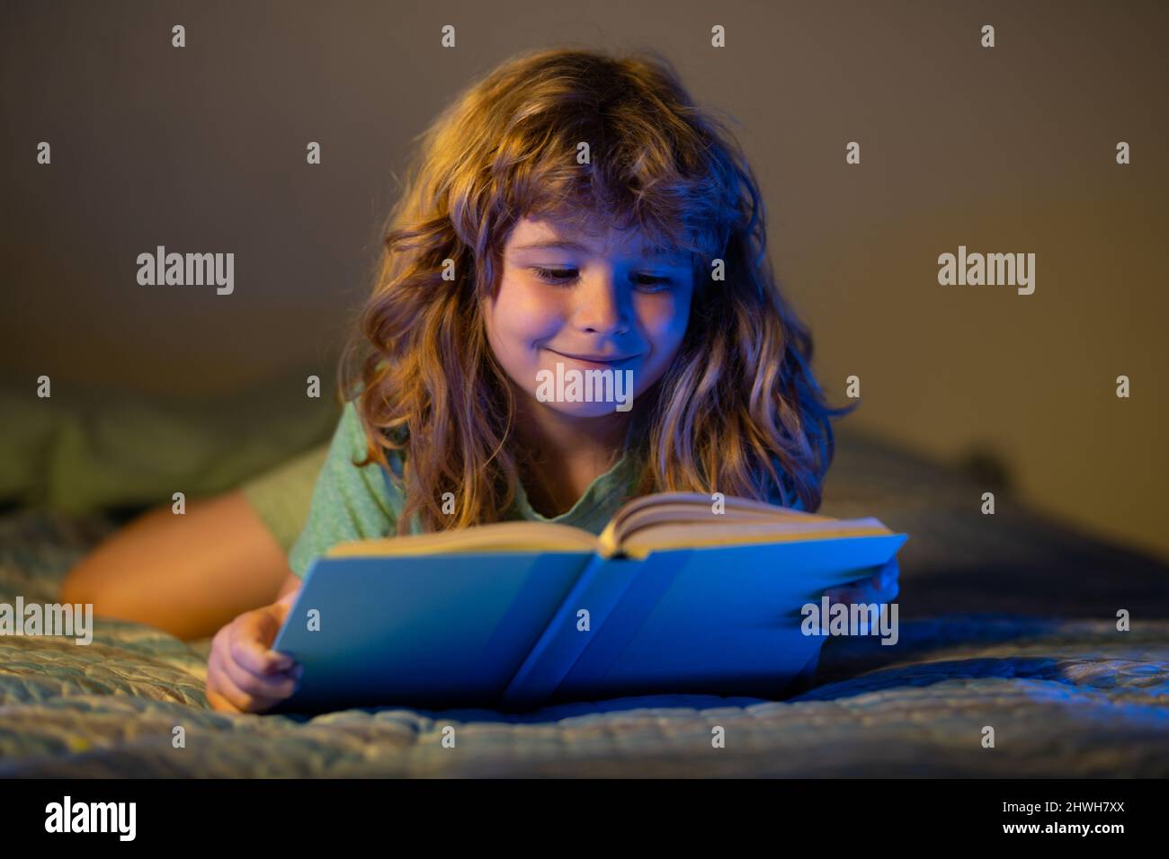 Kids reading books. Child reading a book in bed before going to sleep ...