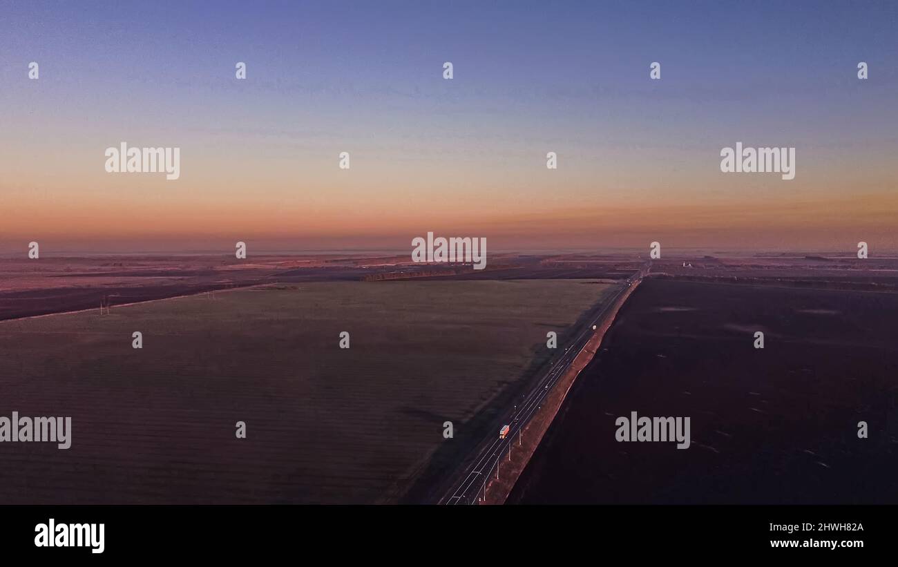 top view over a very beautiful countryside with forest and fields and a ...