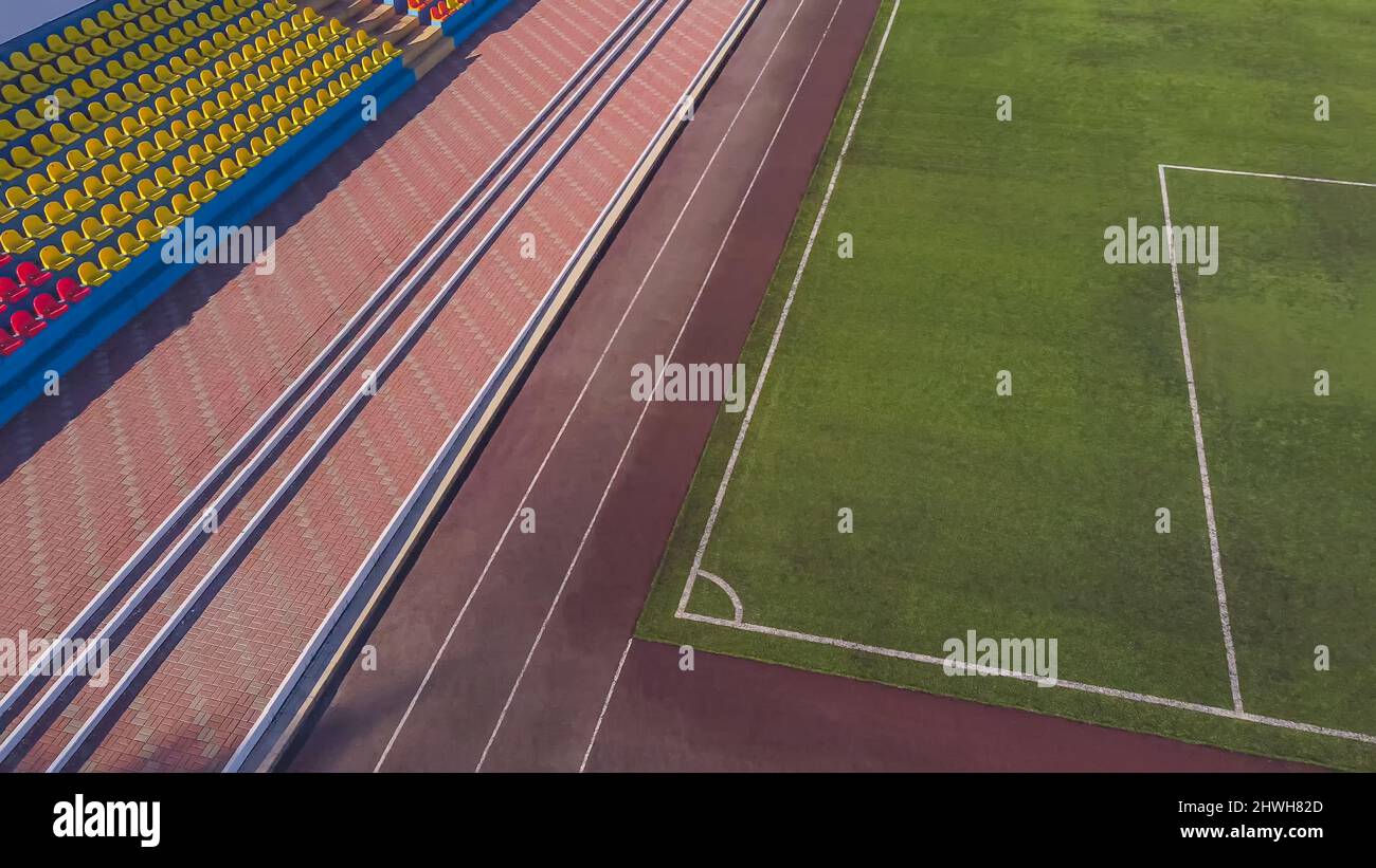 top view over the football field partially with a running track and ...