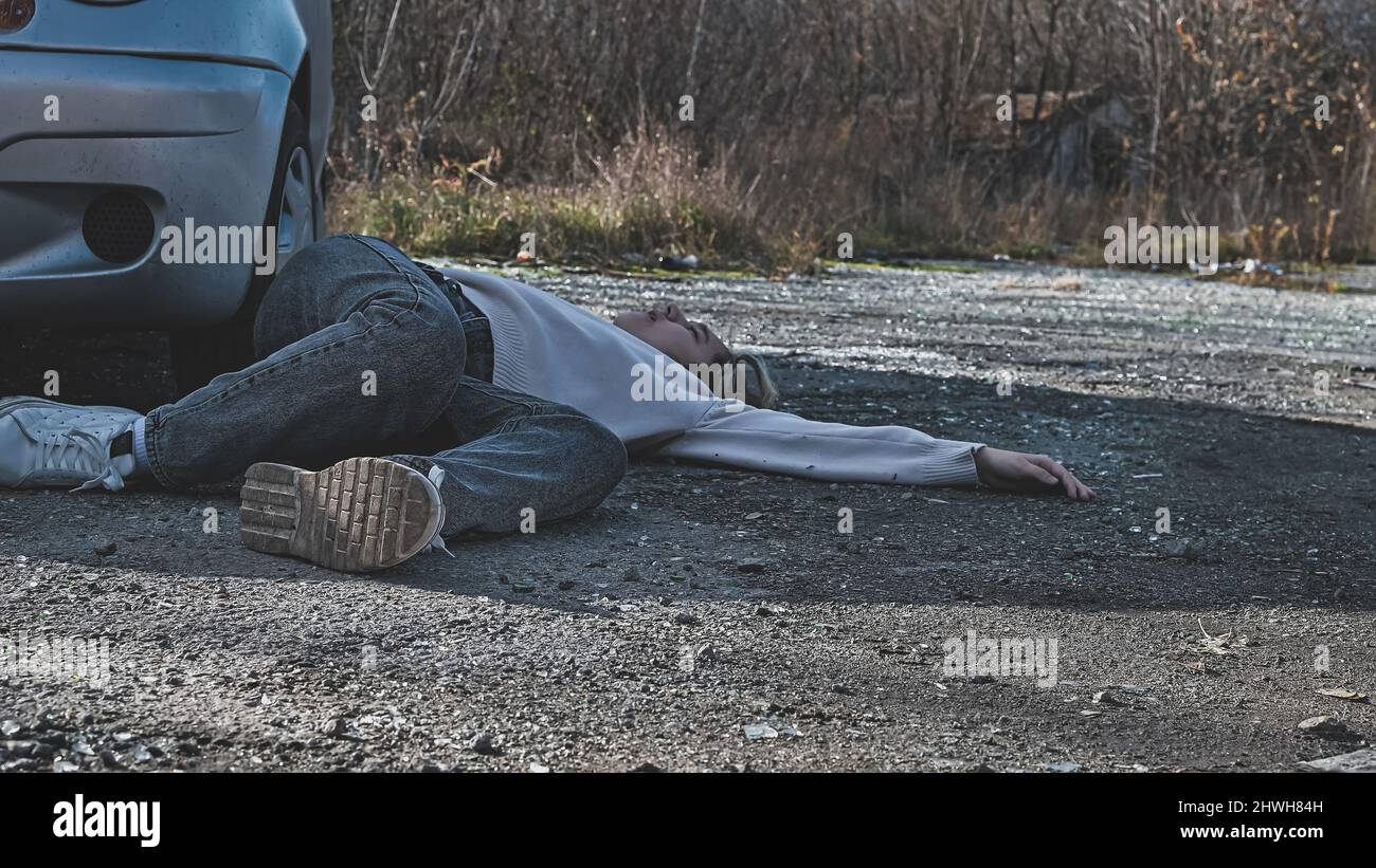 a young teenage girl was hit by a car . lying like a dead corpse on the ...
