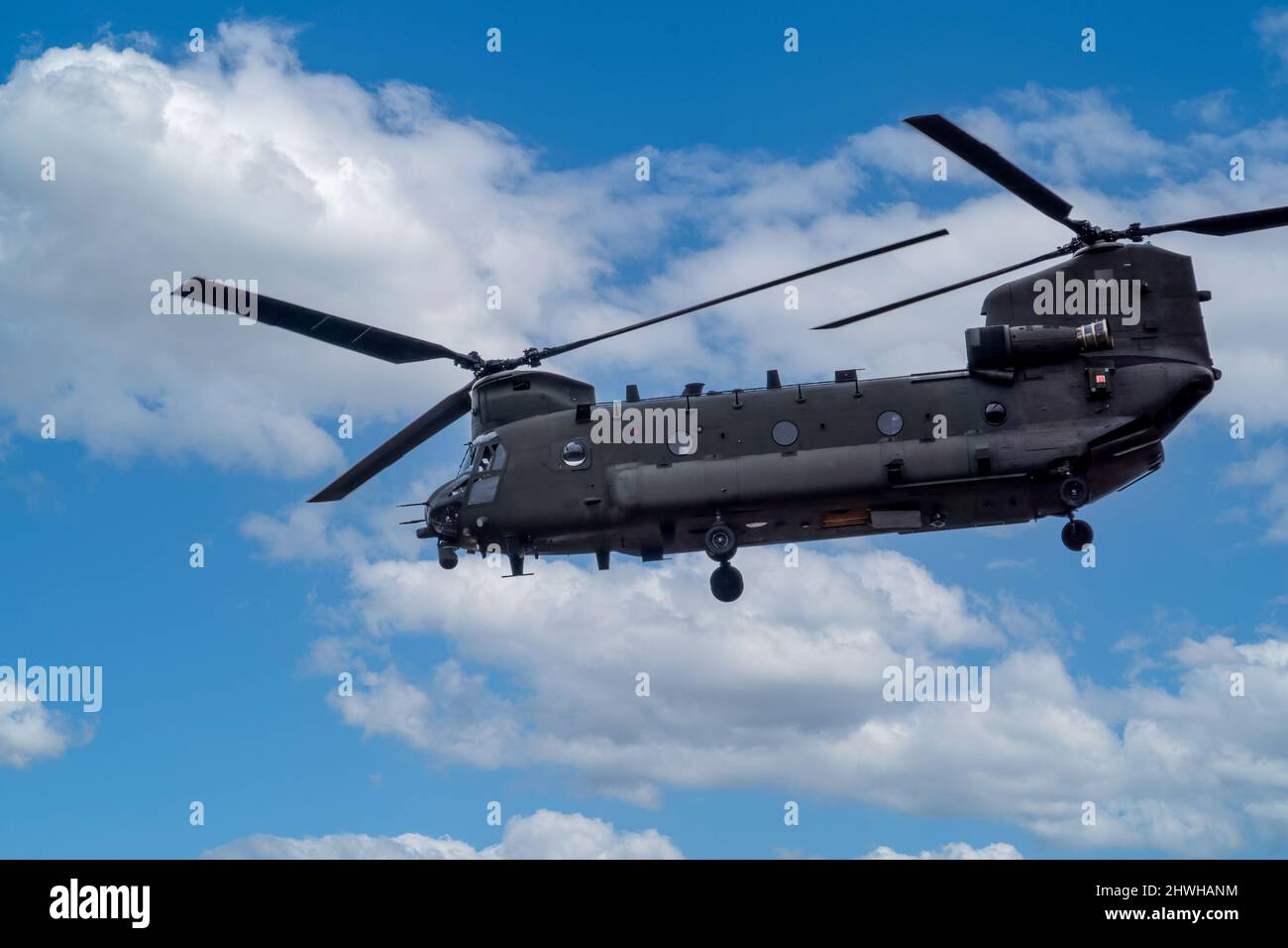 RAF Chinook tandem-rotor CH-47 helicopter flying fast and low in a ...