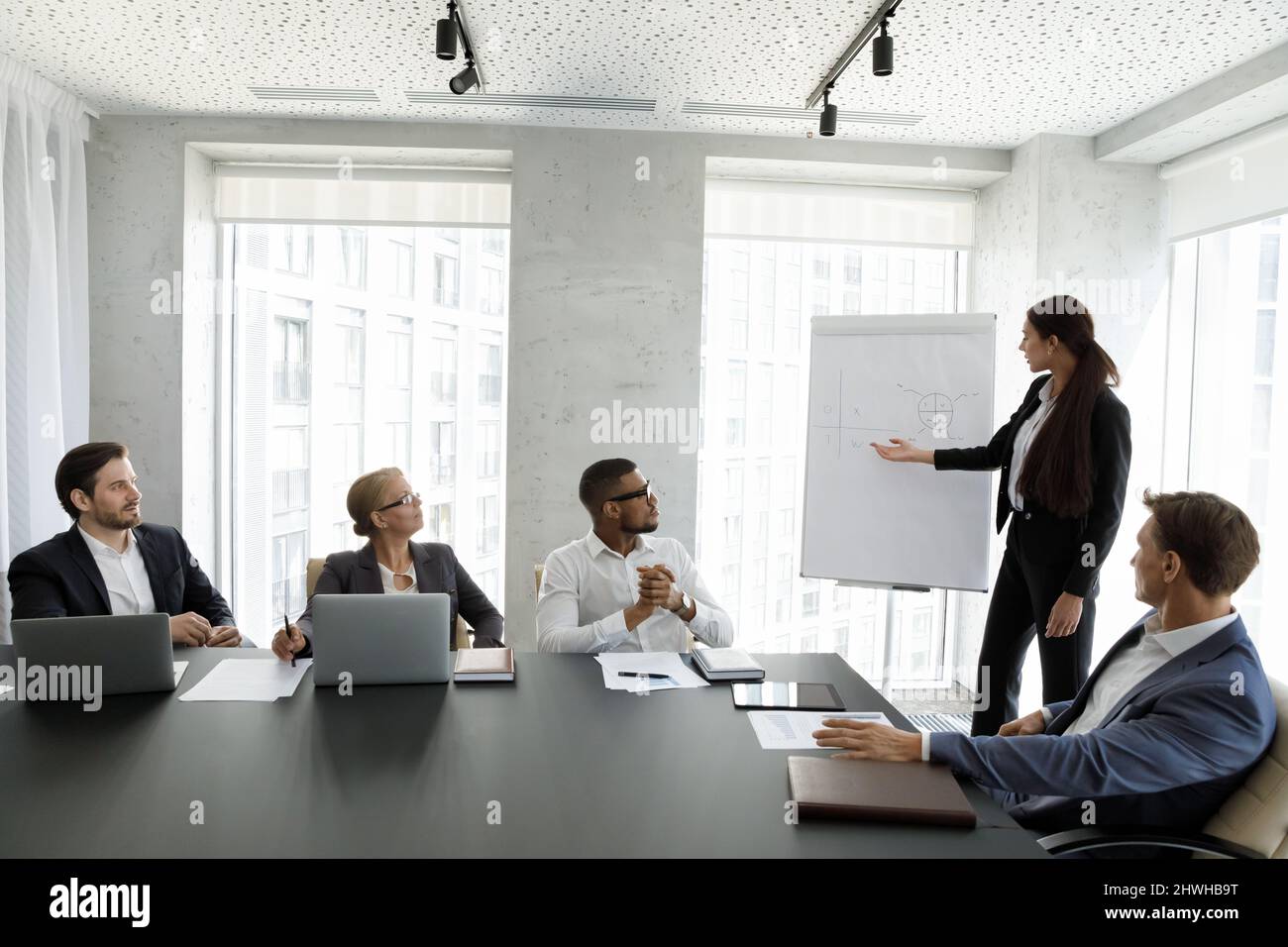 Concentrated professional millennial female speaker giving educational ...