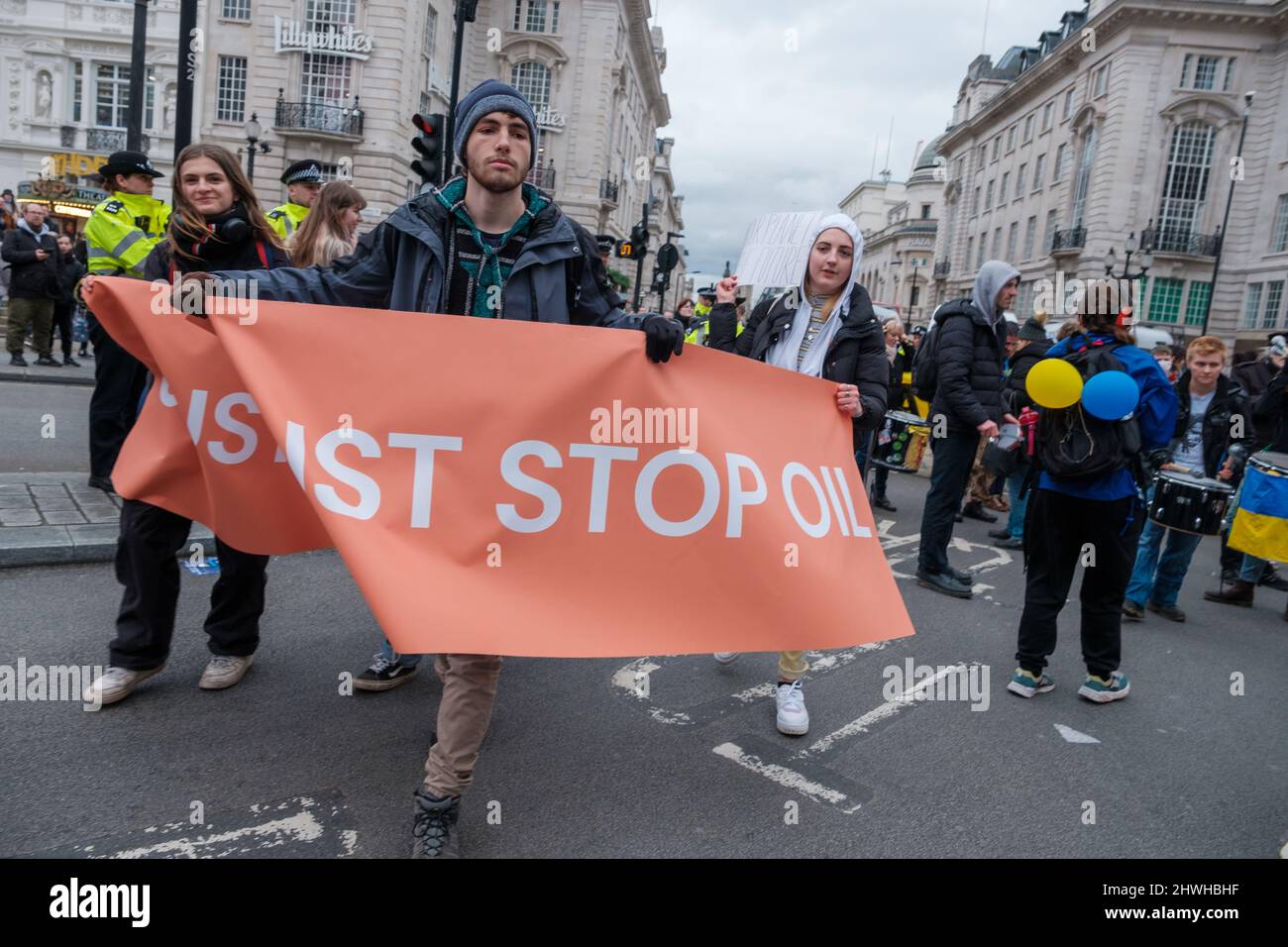 Youth Climate Swarm protest against the use of oil through London ...