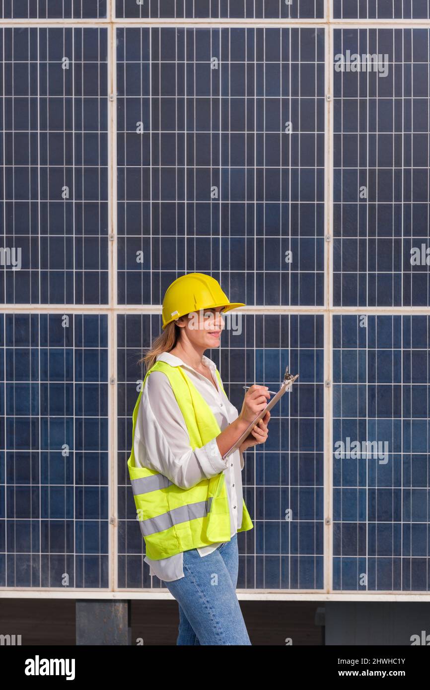 Engineer woman doing test and testing of solar panels Stock Photo - Alamy