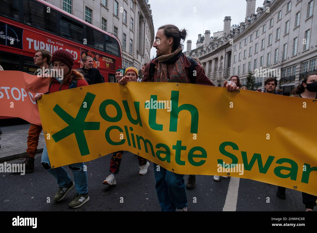 Youth Climate Swarm protest against the use of oil through London ...