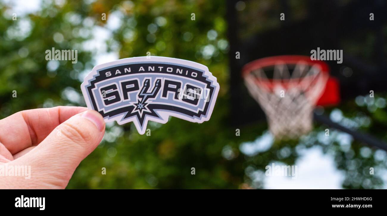 September 15, 2021, San Antonio, USA, A man holds the emblem of the San ...