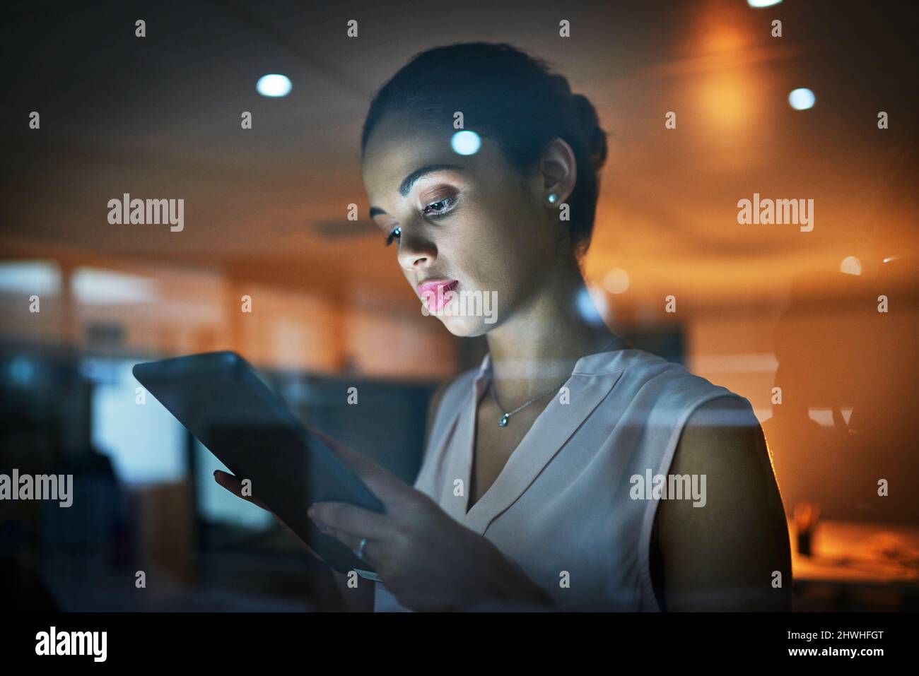 Making her hard work translate into success. Shot of a young ...