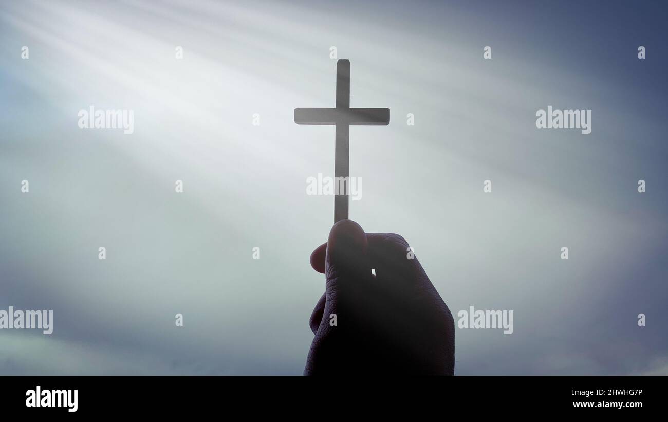 Holding holy cross hi-res stock photography and images - Alamy