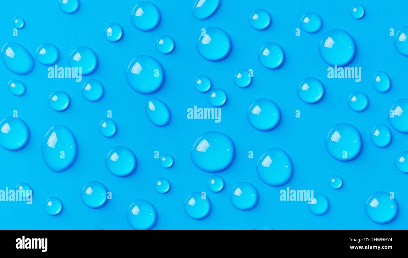 Water drops on blue background. Abstract drops of gel. Face serum ...