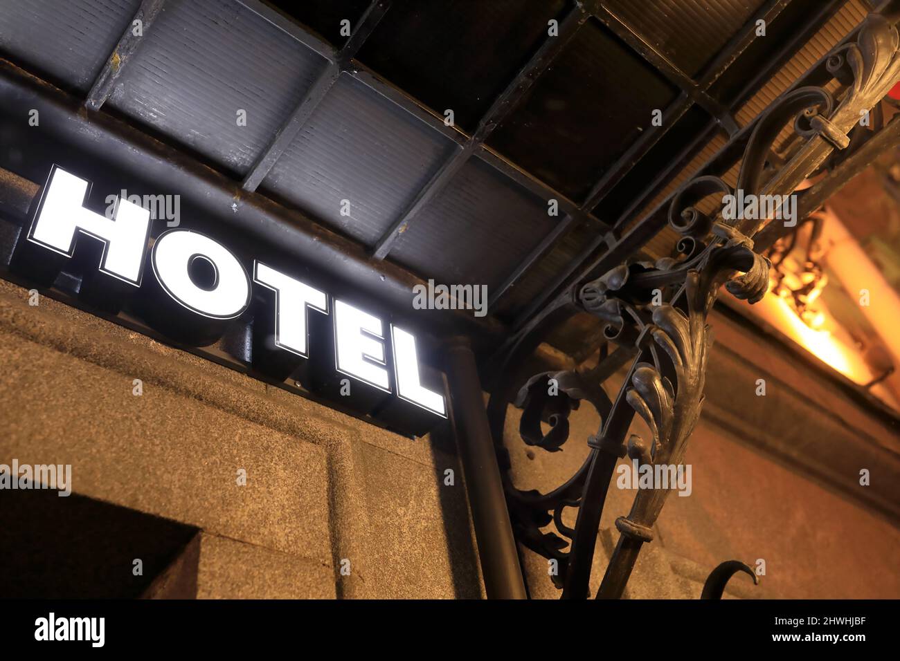 View of hotel signboard on wall of building at night Stock Photo - Alamy