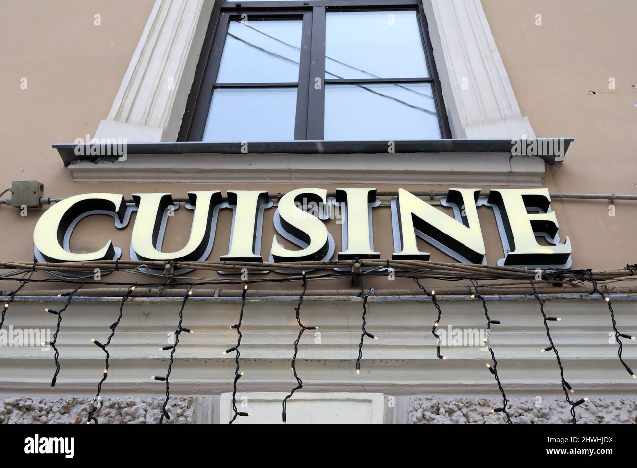 View of cuisine signboard on wall of building Stock Photo - Alamy