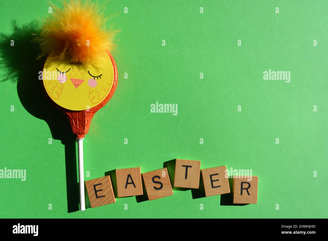 Easter, word in wooden alphabet letters with cute chick shaped ...